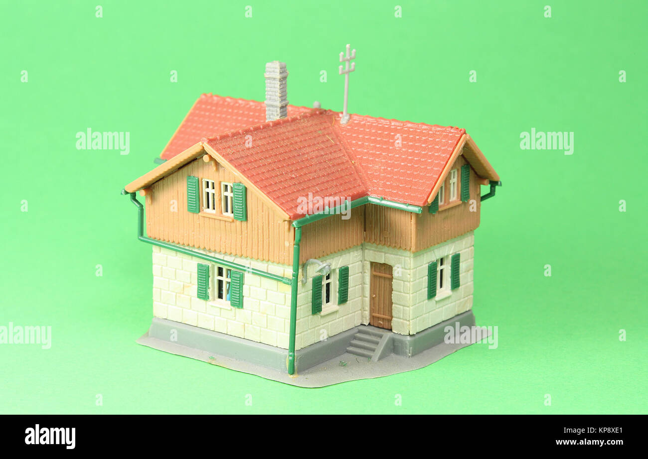 Cottage,model house with green background Stock Photo - Alamy