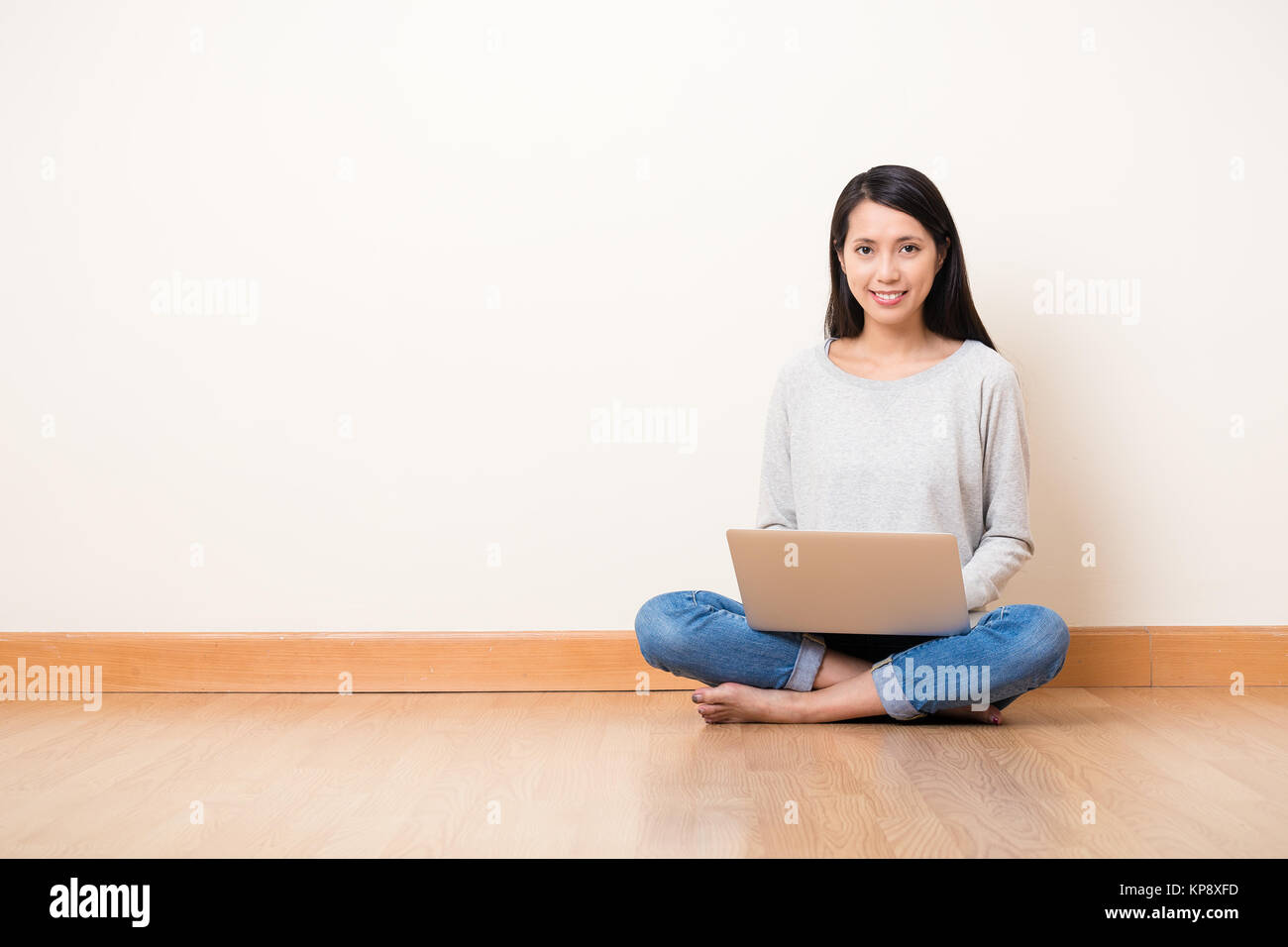 Woman working at home with laptop computer Stock Photo - Alamy