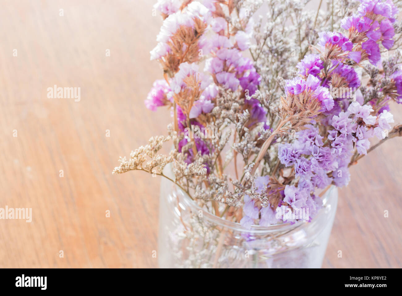 Beautiful statice flower bouquet on wooden table Stock Photo - Alamy
