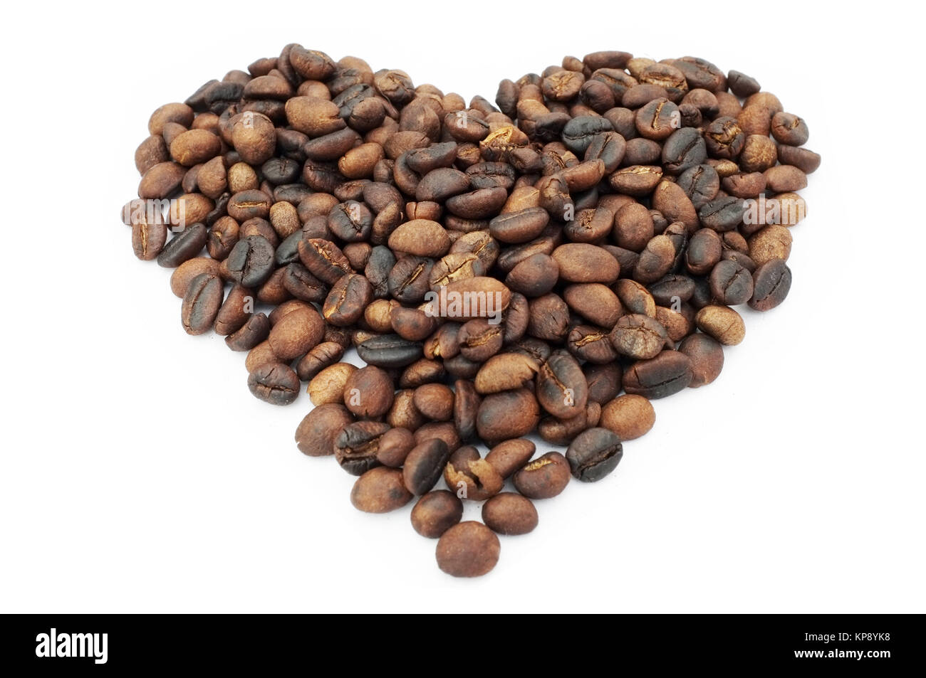 Heart shape coffee beans on white background Stock Photo - Alamy