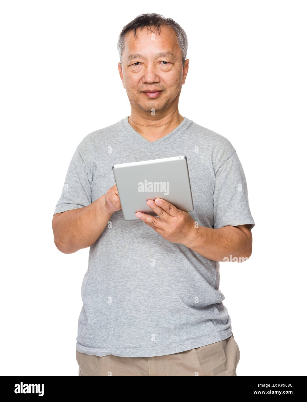 Senior man use of tablet Stock Photo - Alamy