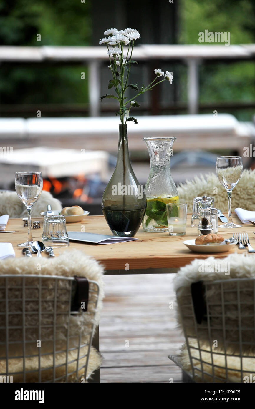 covered table on a terrace Stock Photo - Alamy