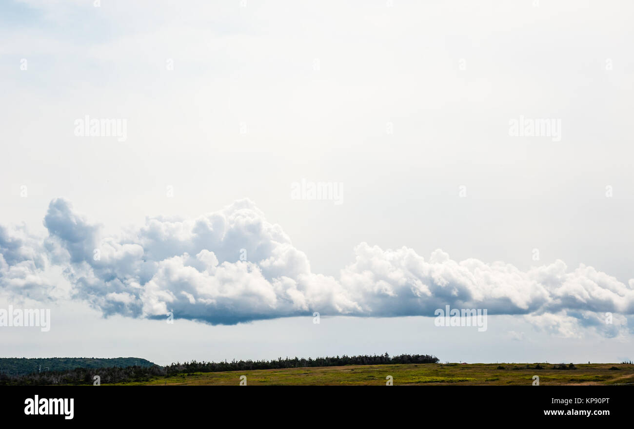 Layer of low cumulus clouds forming over terrain Stock Photo - Alamy