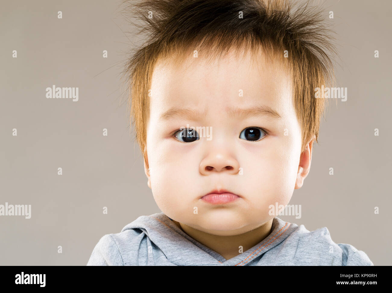 Serious baby boy Stock Photo - Alamy