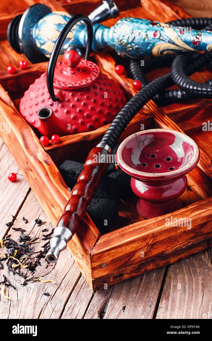 Details of Smoking hookah and red metal kettle spilled tea leaf Stock ...