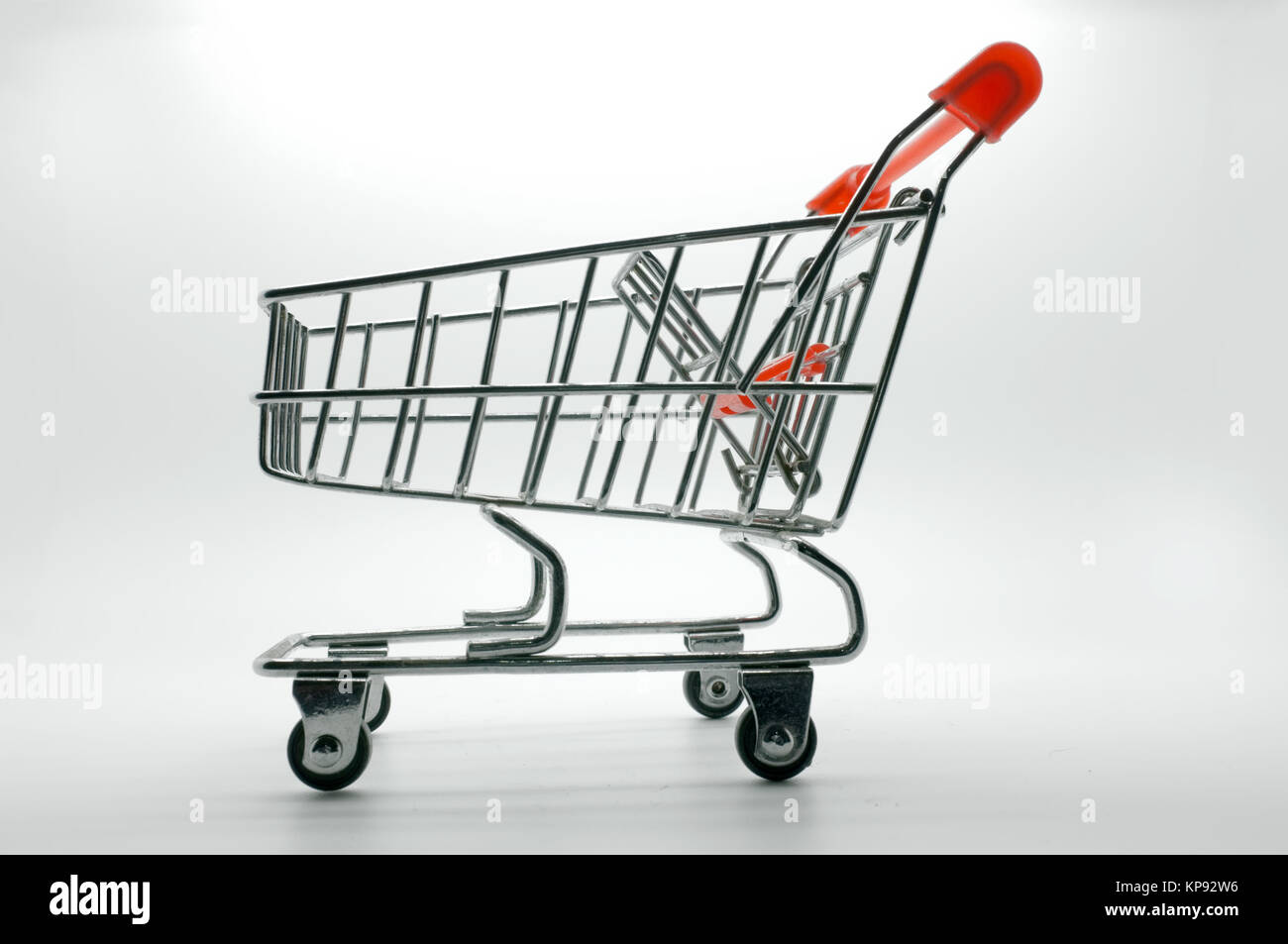 Empty shopping cart, side view, on white background Stock Photo - Alamy