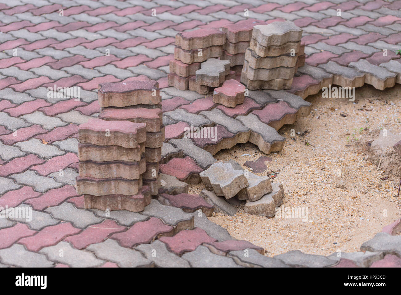 Broken footpath sand ground collapse patholes Stock Photo - Alamy