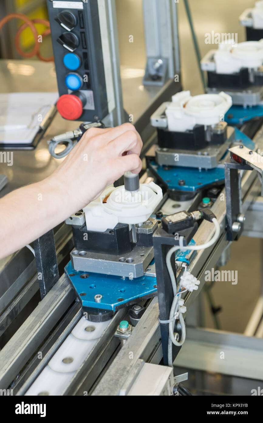 Hand of worker woman on the assembly line Stock Photo - Alamy
