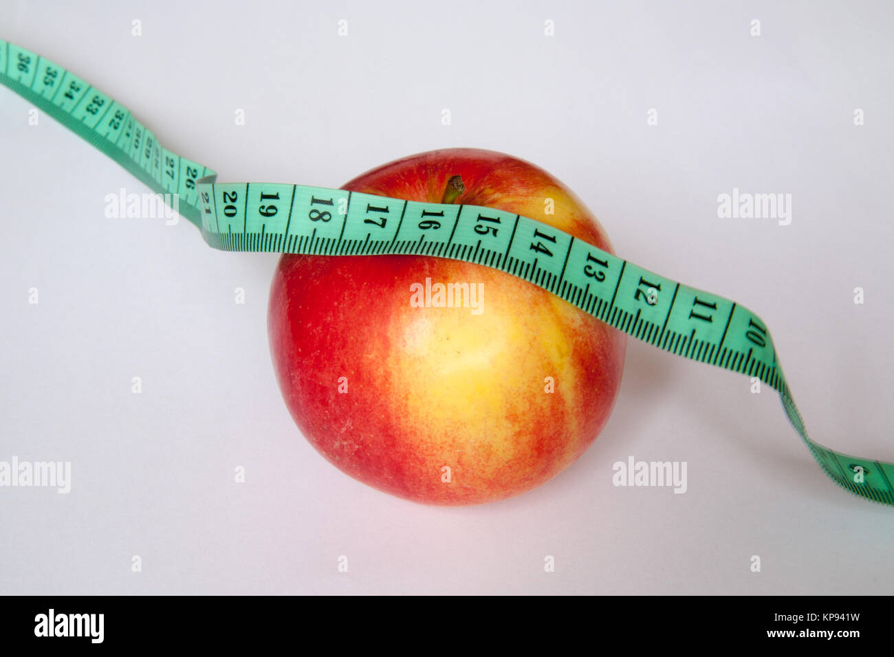 Apple and ruler are isolated on a white background Stock Photo - Alamy