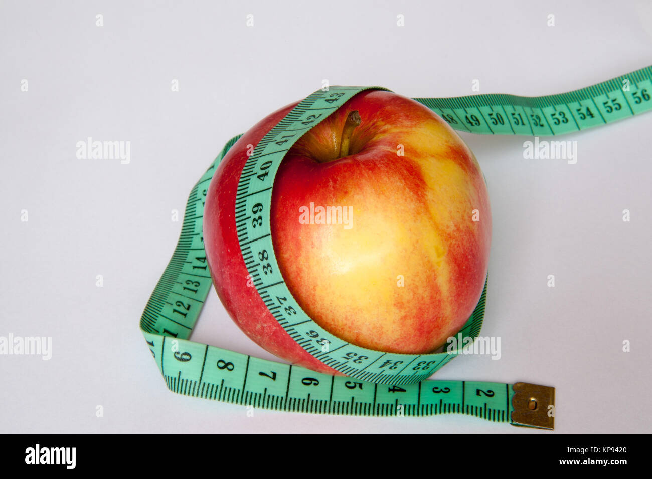 Apple and ruler are isolated on a white background Stock Photo - Alamy