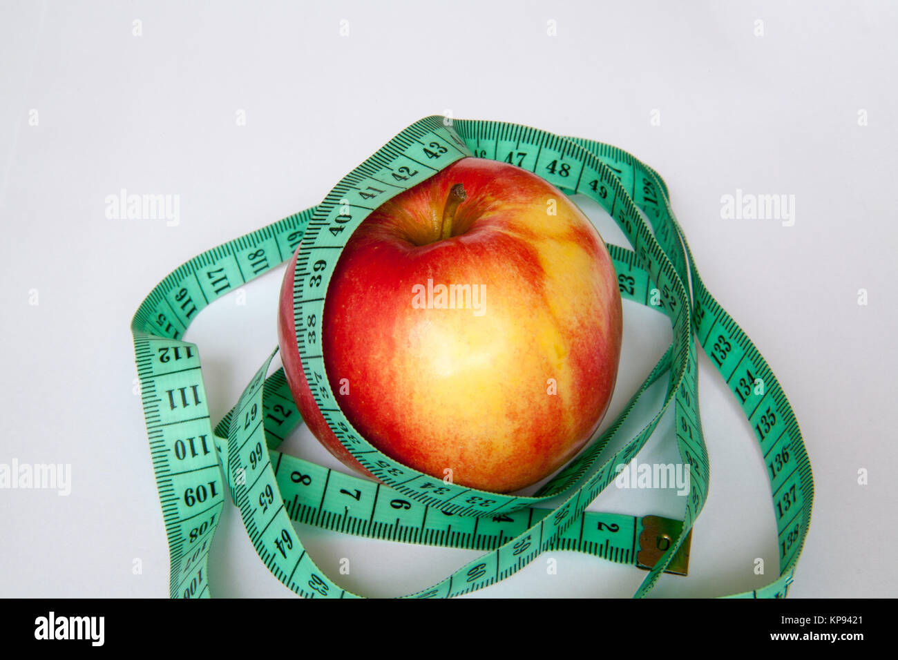 Apple and ruler are isolated on a white background Stock Photo - Alamy