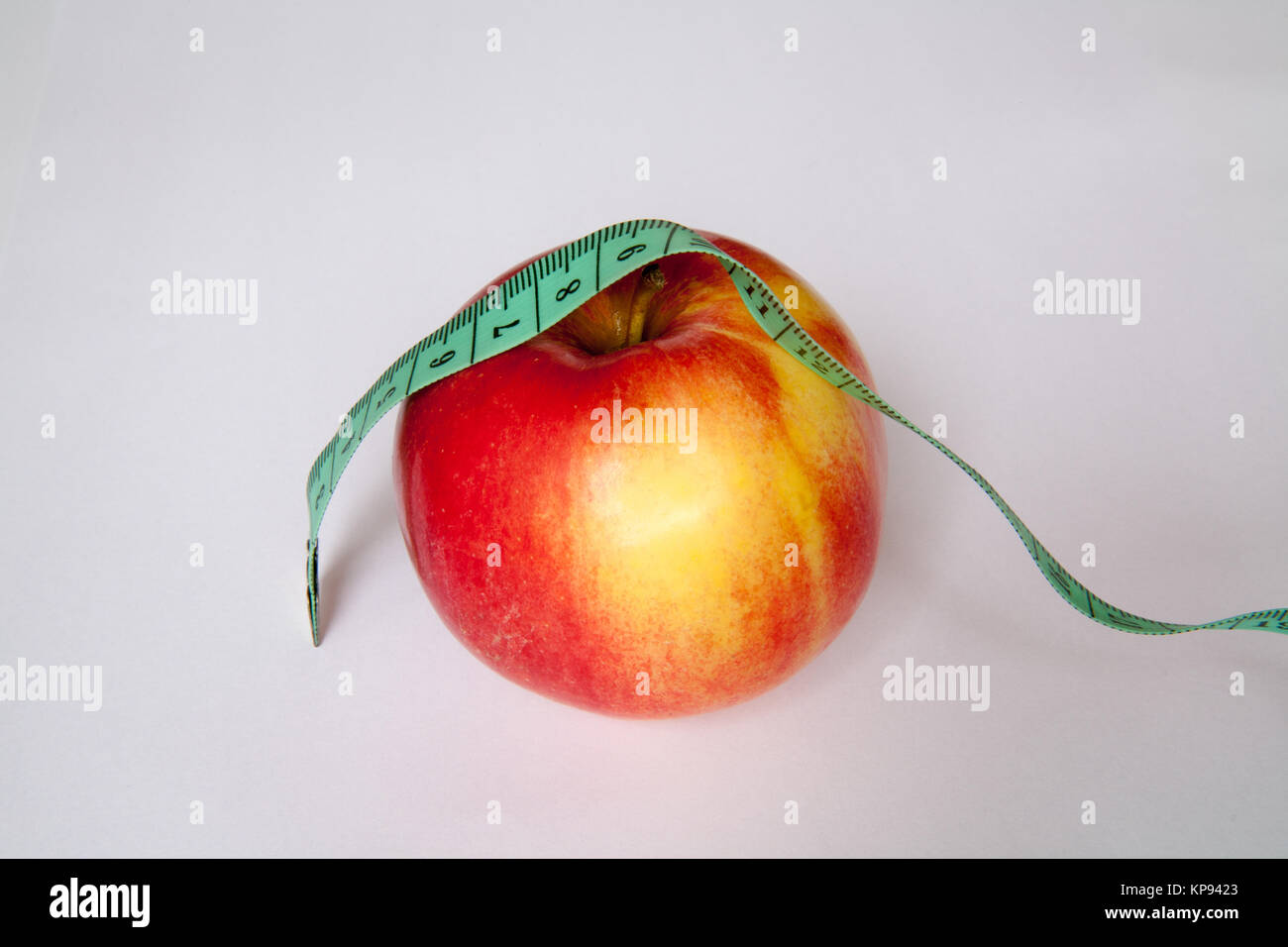Apple and ruler are isolated on a white background Stock Photo - Alamy