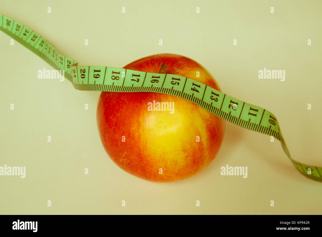 Apple and ruler are isolated on a white background Stock Photo - Alamy