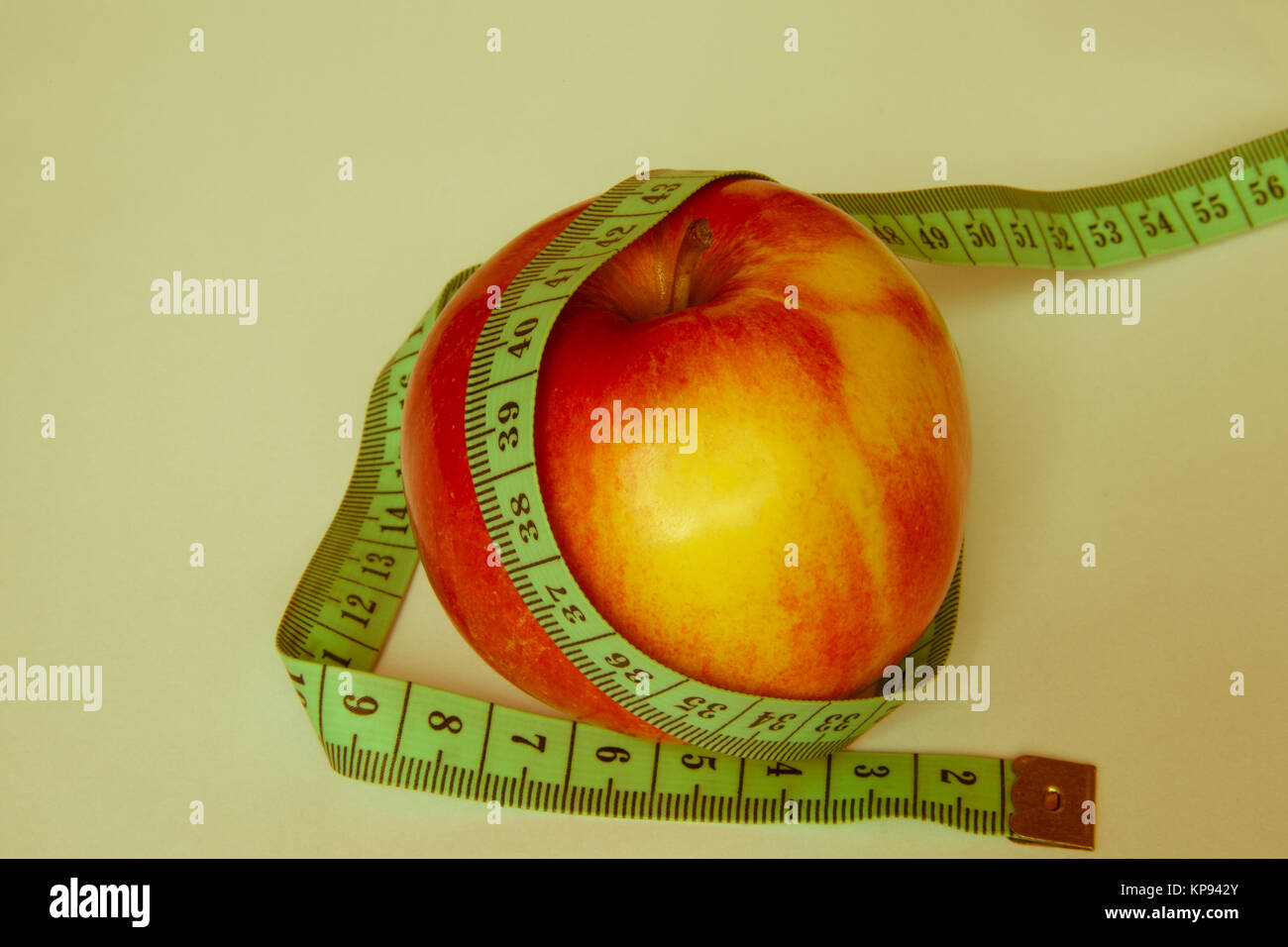Apple and ruler are isolated on a white background Stock Photo - Alamy