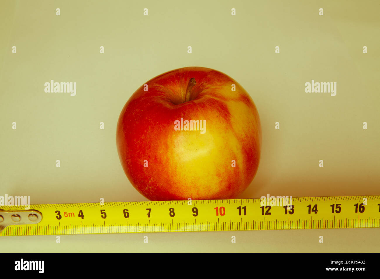 Apple and ruler are isolated on a white background Stock Photo - Alamy