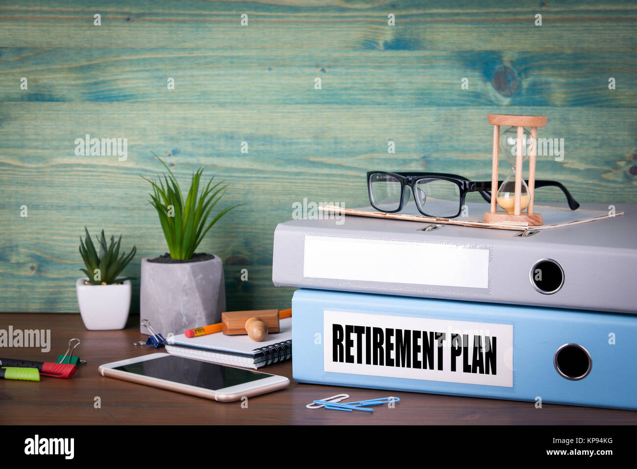 retirement plan concept. Binders on desk in the office. Business ...