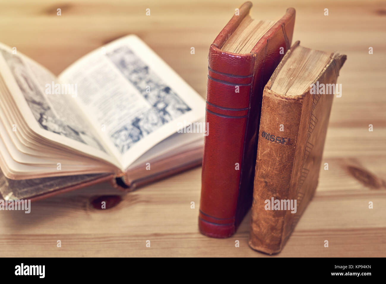 Old missal. Old mass books with leather cover on rustic wooden table ...
