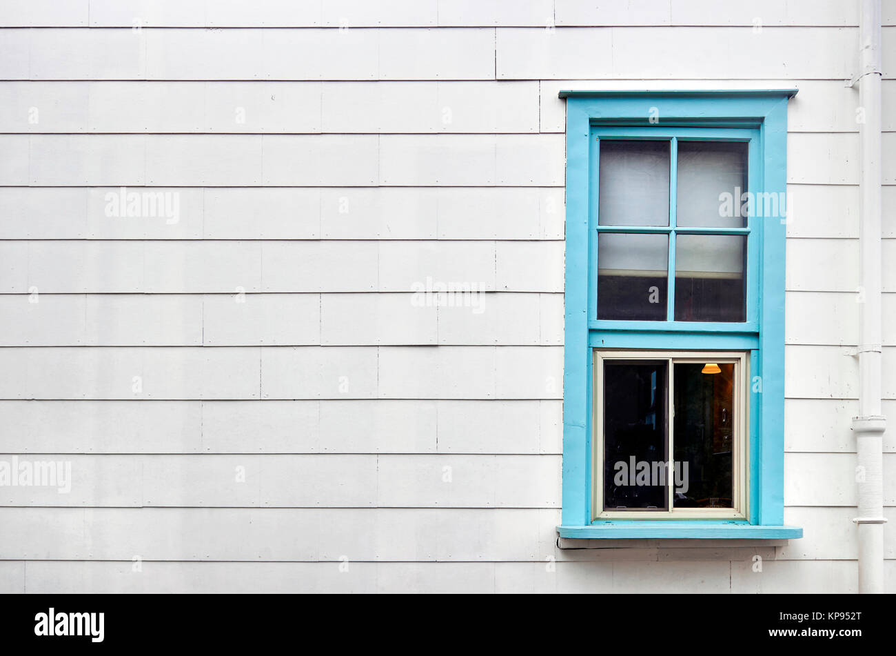 Blue window on white wall Stock Photo - Alamy