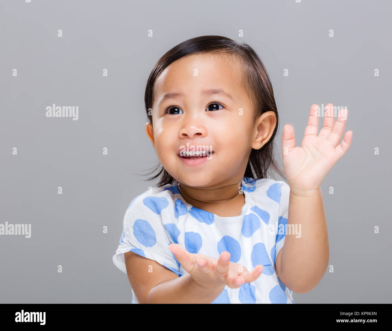 Baby girl clap hand Stock Photo - Alamy