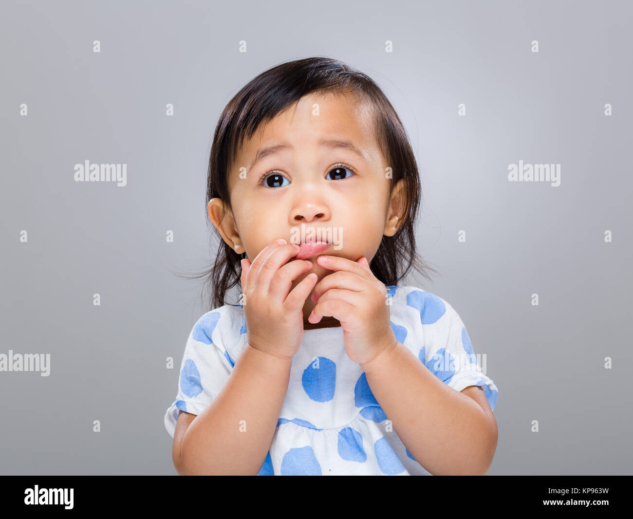Baby girl with funny face expression Stock Photo - Alamy