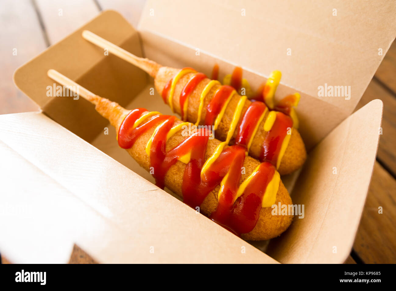 Corn dog in paper box Stock Photo - Alamy
