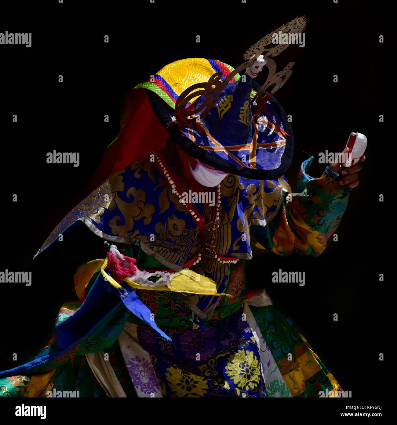 Buddhist monk in traditional Tibetan robes performs a sacred Dance of ...