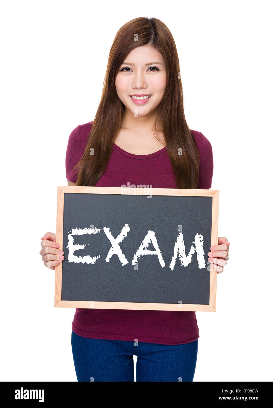 Woman hold with blackboard showing a word exam Stock Photo - Alamy