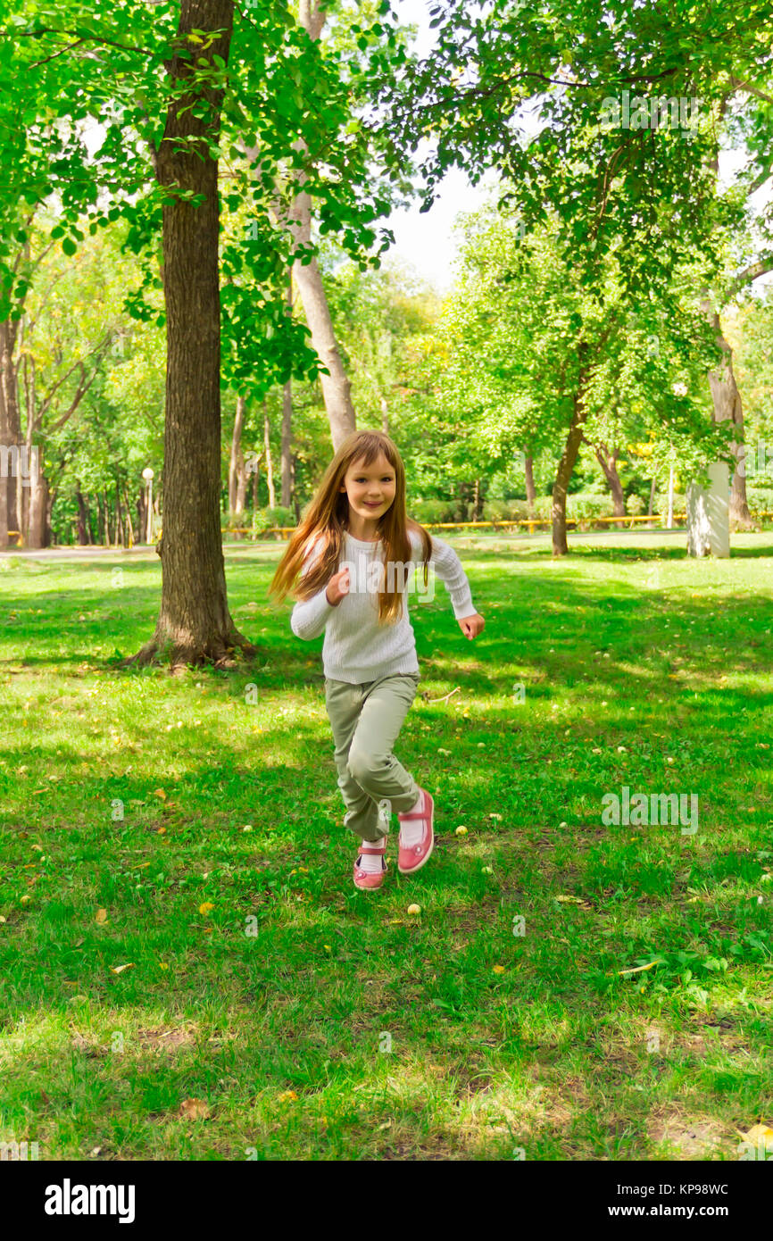 Cute running girl Stock Photo - Alamy