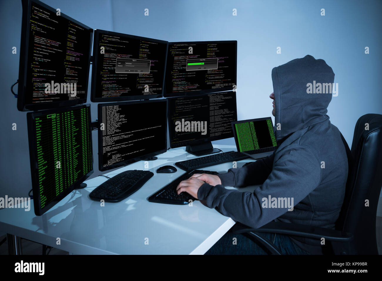 Hacker Using Computers To Steal Data Stock Photo - Alamy
