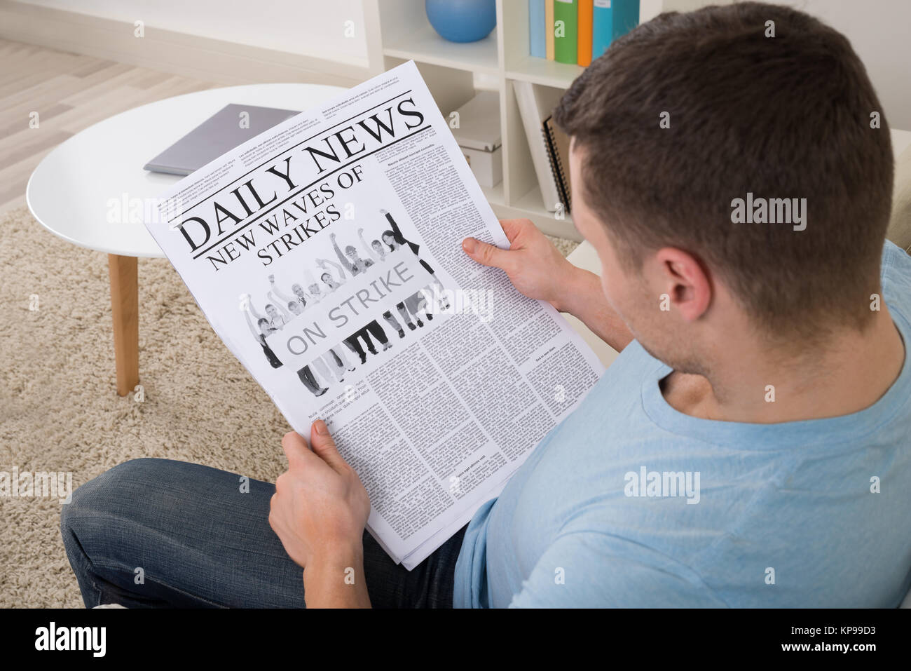 Man Reading News On Newspaper At Home Stock Photo - Alamy