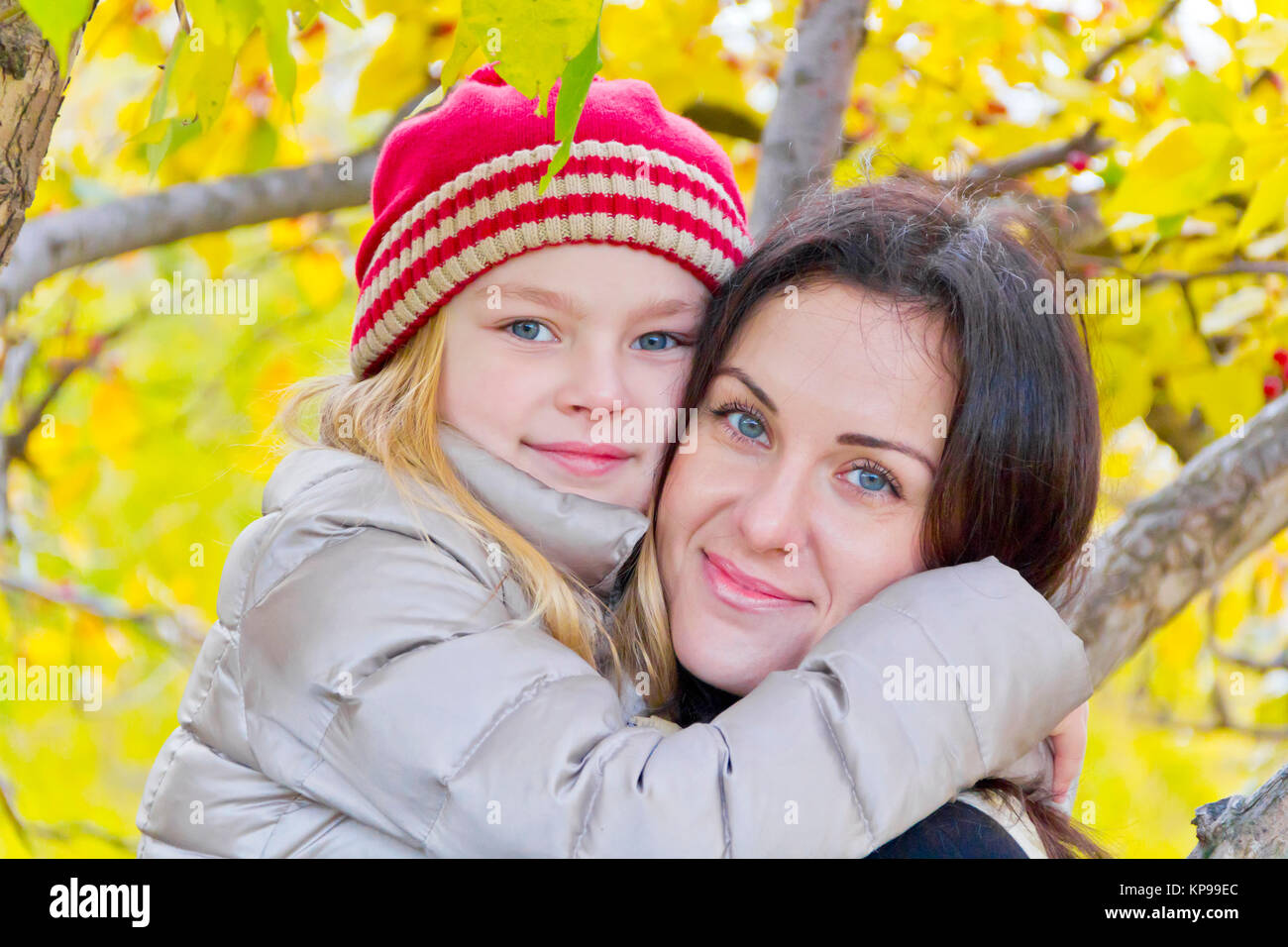Happy mother and daughter in autumn Stock Photo - Alamy