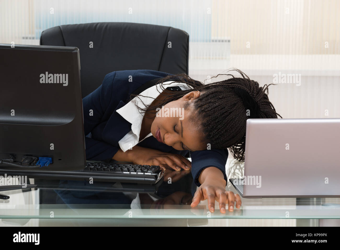 Businesswoman Sleeping On Desk Stock Photo - Alamy
