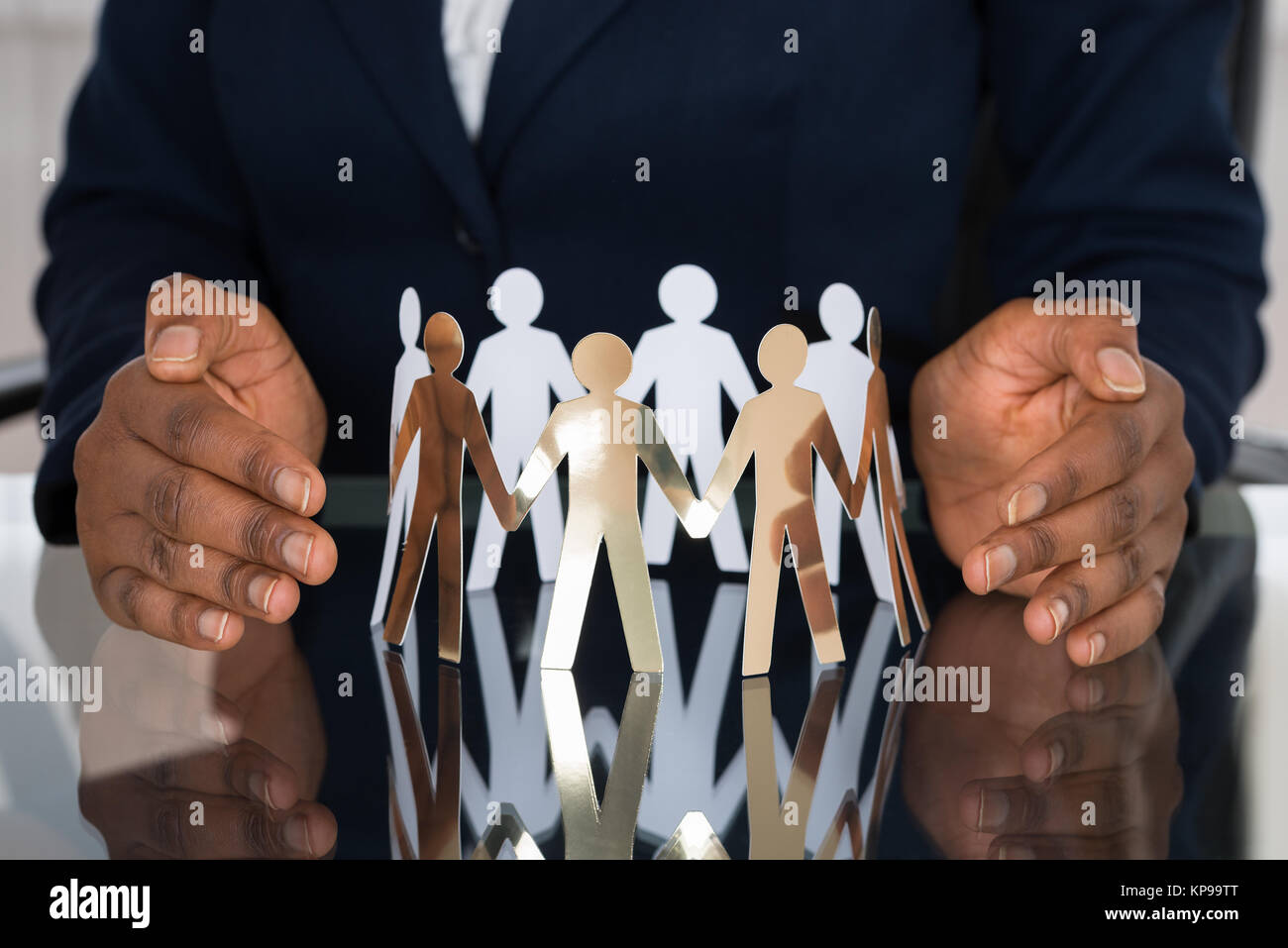 Human Hand Protecting Cut-out Figures Stock Photo - Alamy