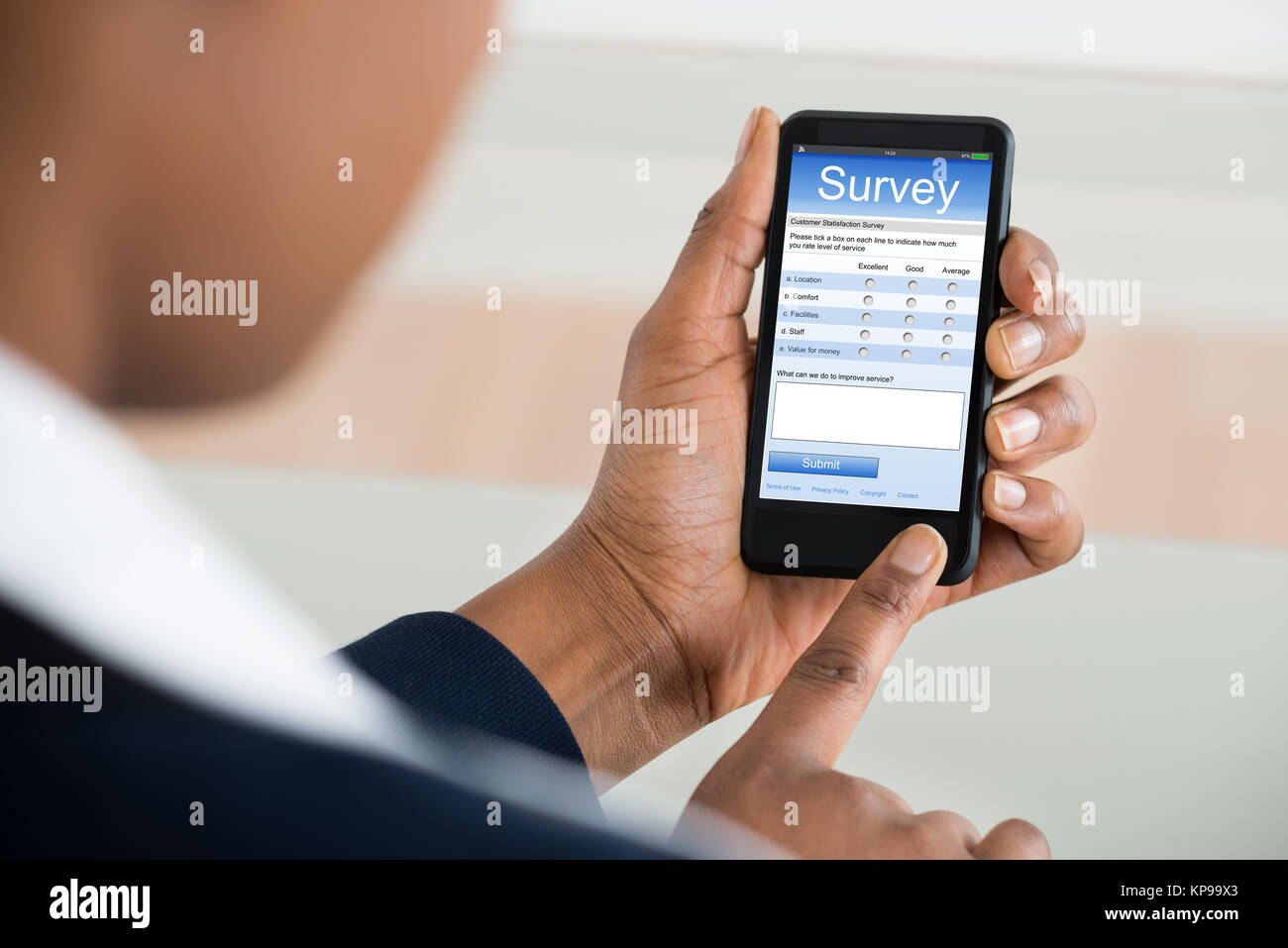 Businesswoman Filling Survey Form On Mobile Phone Stock Photo - Alamy
