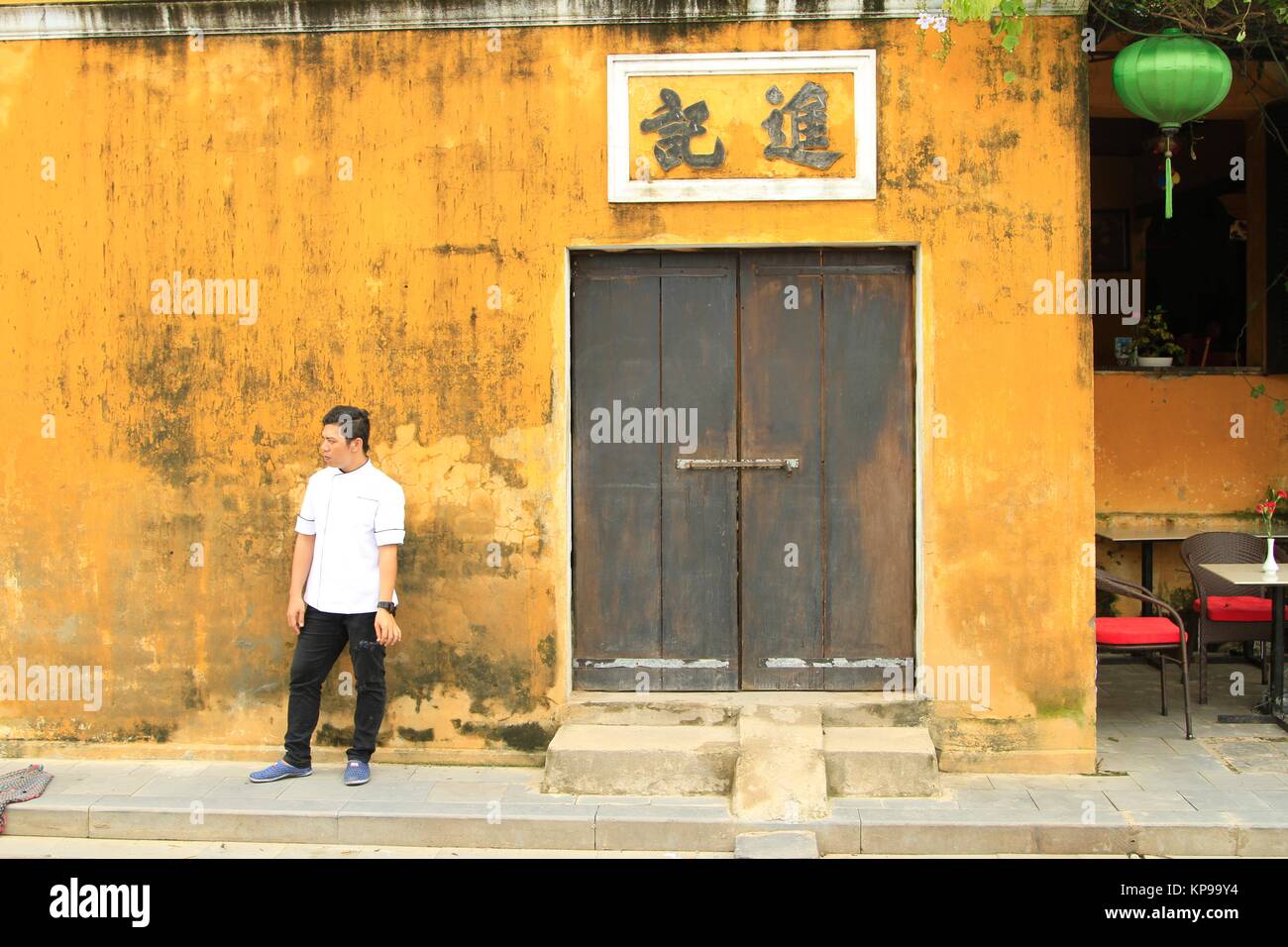 Hoi An chef takes a smoke break behind the restaurant, Central Vietnam ...