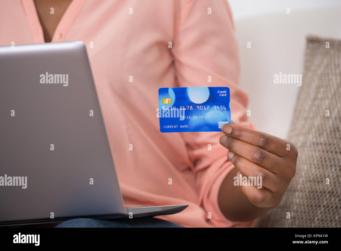 Woman Holding Debit Card For Online Shopping On Laptop Stock Photo - Alamy
