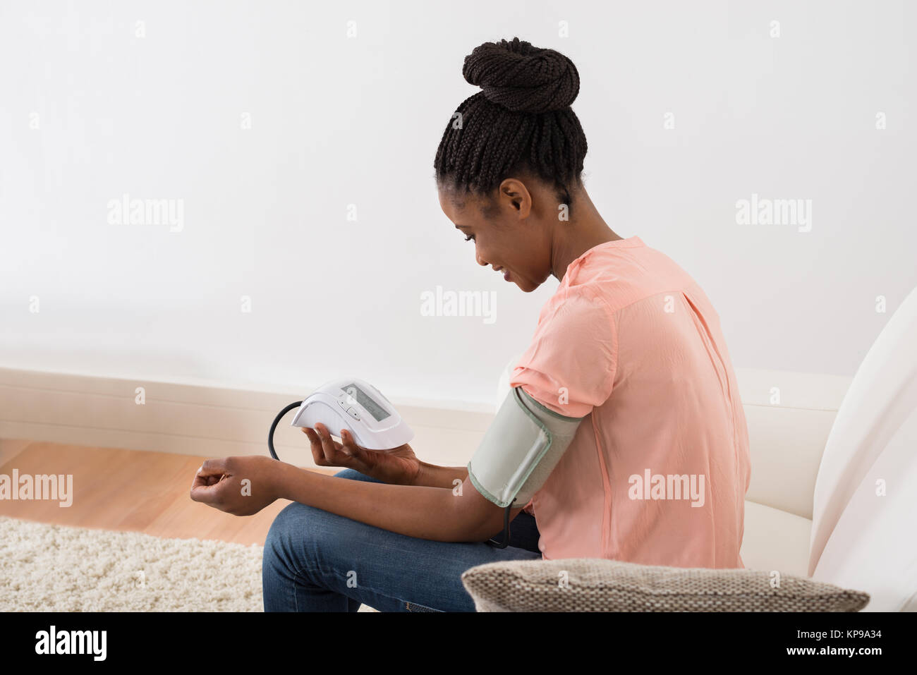 Woman Checking Blood Pressure Stock Photo - Alamy