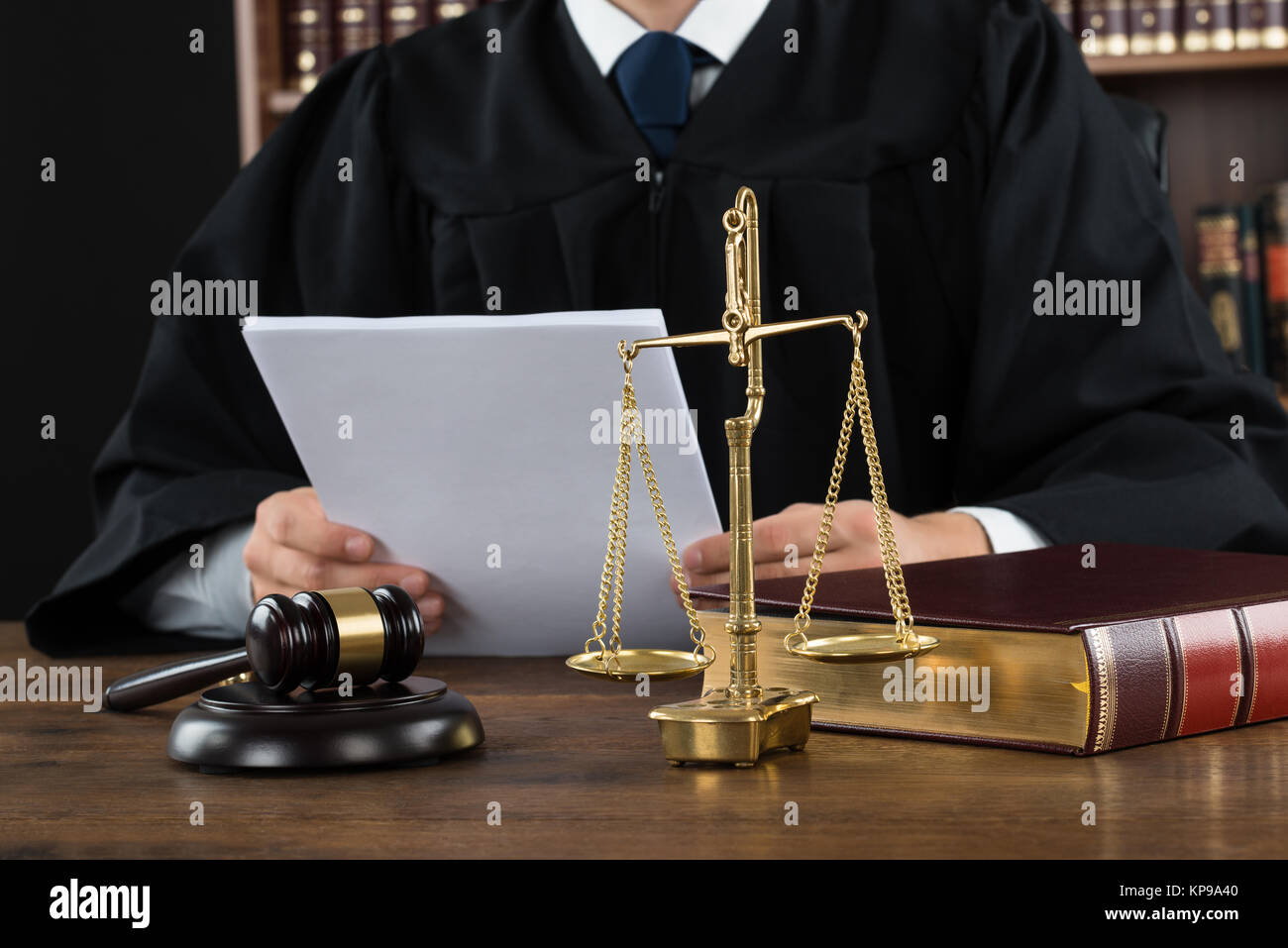 Judge Reading Documents At Desk In Courtroom Stock Photo - Alamy