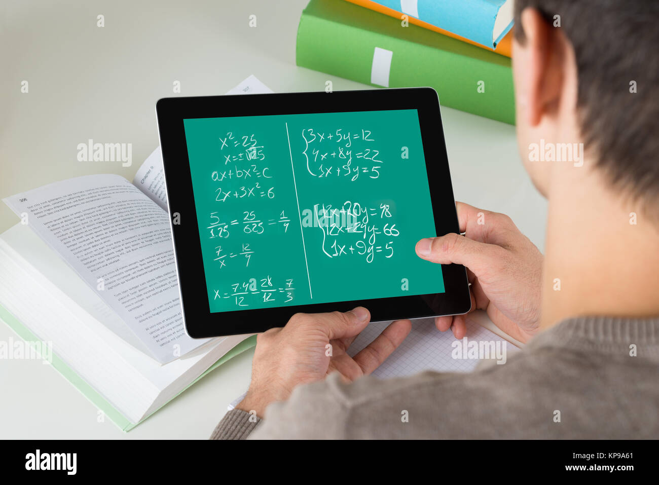 Student Learning Mathematical Equations On Digital Tablet Stock Photo ...