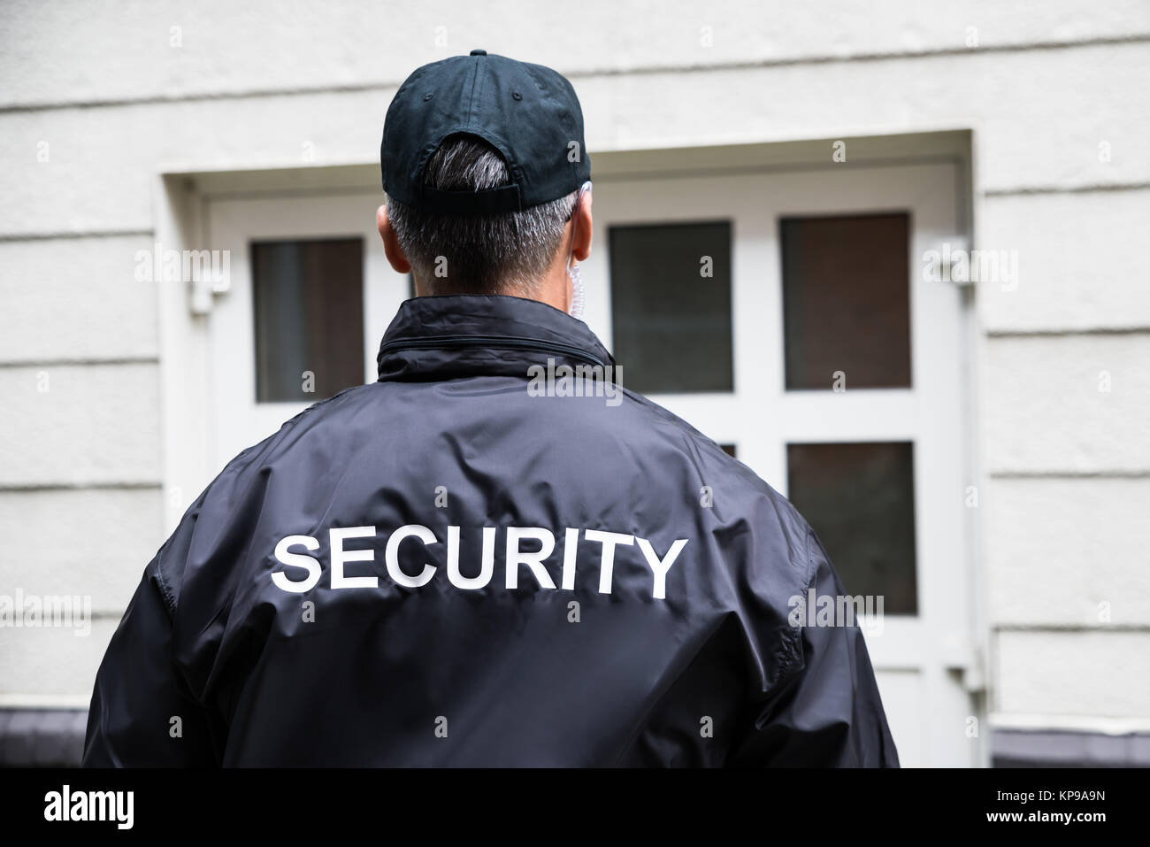 Security Guard Standing Outside Building Stock Photo - Alamy