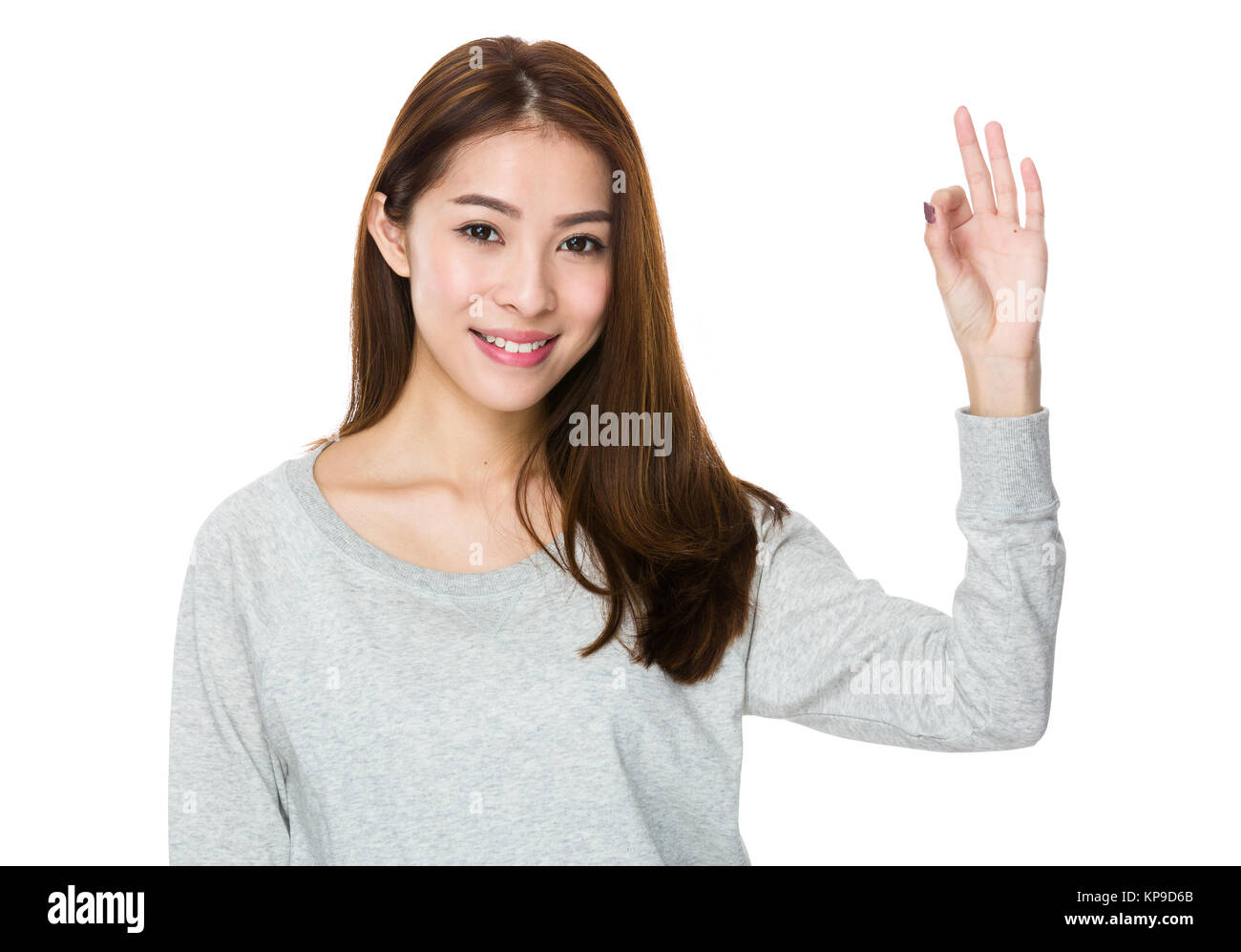 Woman showing ok sign gesture Stock Photo - Alamy