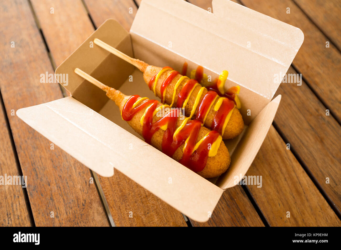 Corn dog in paper box Stock Photo - Alamy
