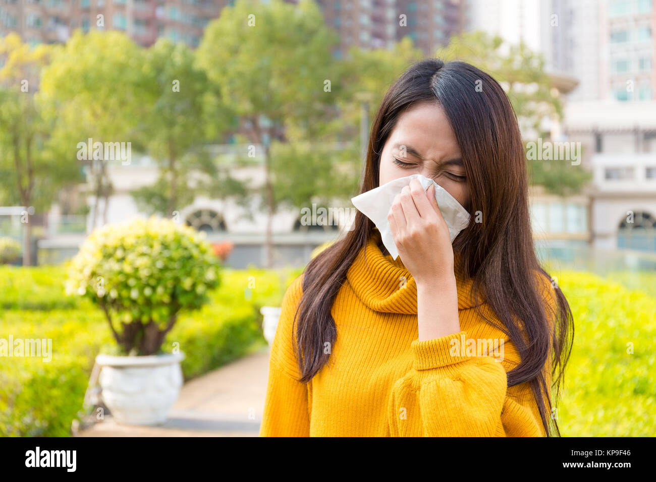 Asian Young Woman got allergy of nose when standing outdoor Stock Photo ...