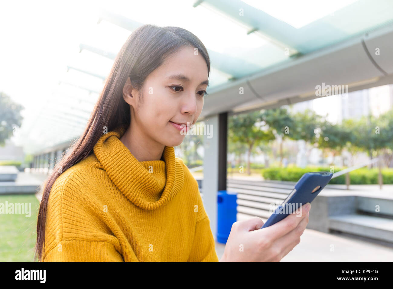 Woman check the information on cellphone Stock Photo - Alamy