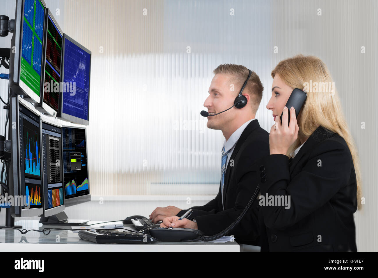Business People Analyzing Data Displayed On Computer Screens Stock ...