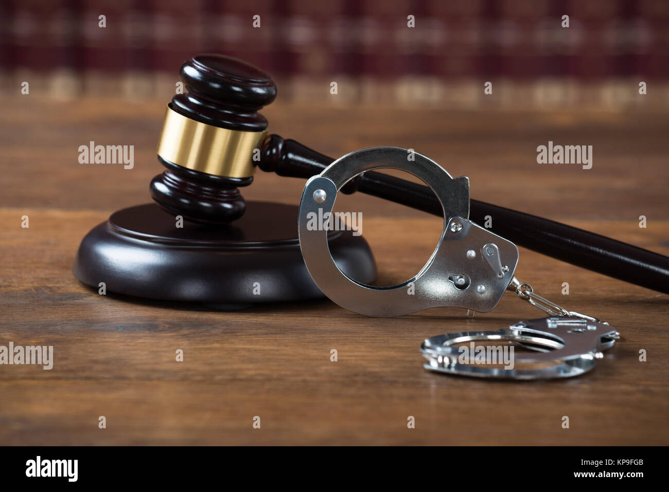 Mallet And Handcuffs On Table In Courtroom Stock Photo - Alamy
