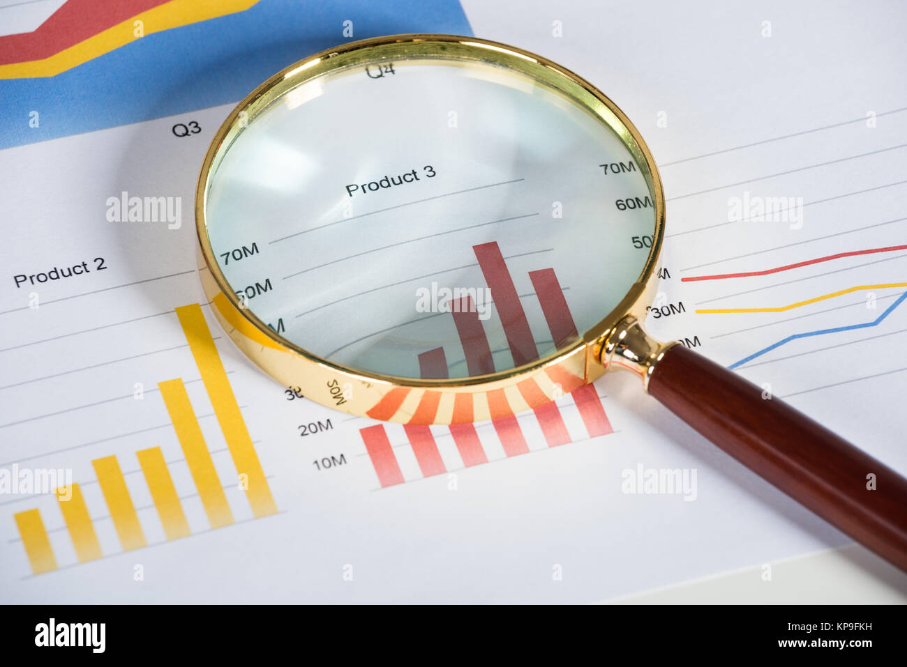 Magnifying Glass On Financial Chart Stock Photo - Alamy