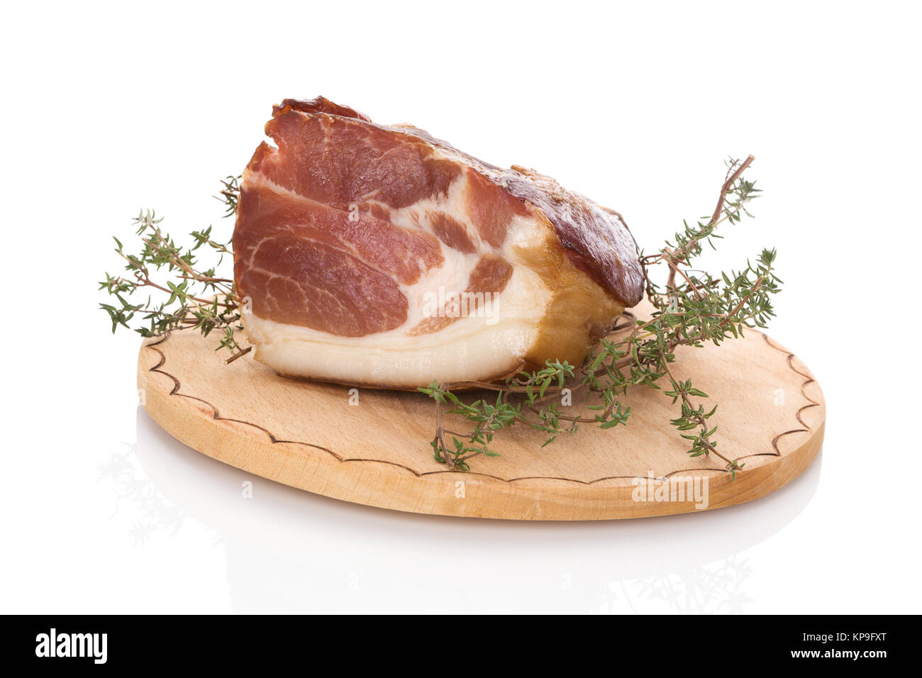 Traditional smoked meat on wooden chopping board isolated on white ...