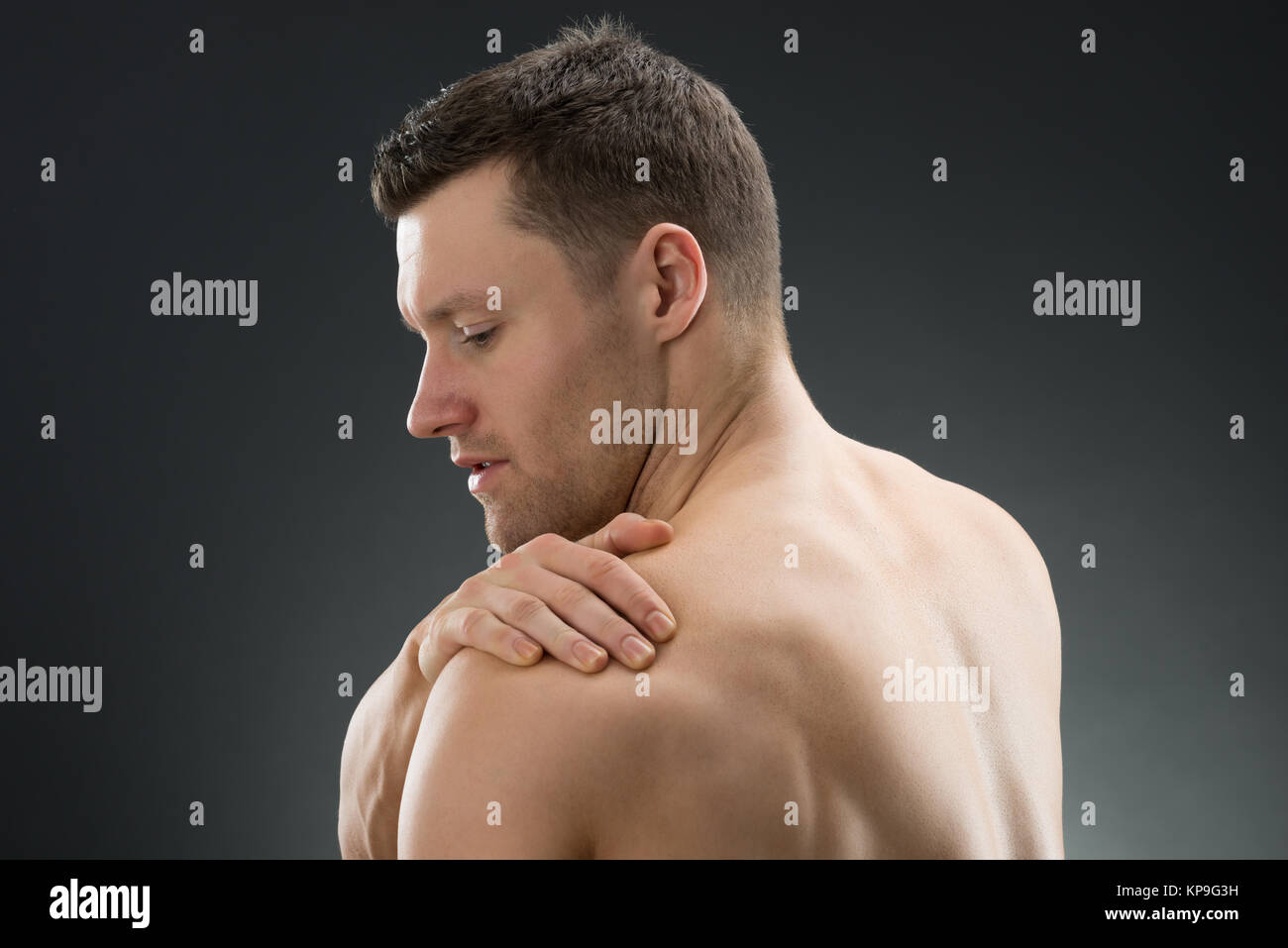 Muscular Man Suffering From Shoulder Ache Stock Photo - Alamy