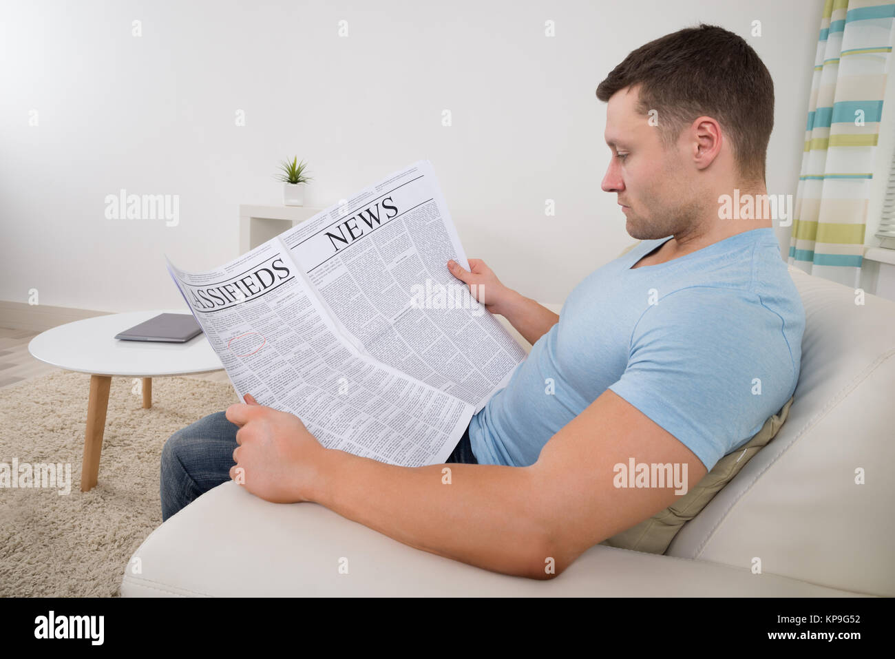 Man Reading Newspaper At Home Stock Photo - Alamy